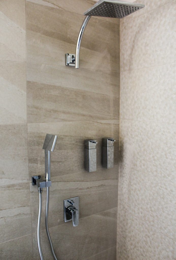 Sliding Shower Rail v Fixed Shower Head - On The Ball Bathrooms