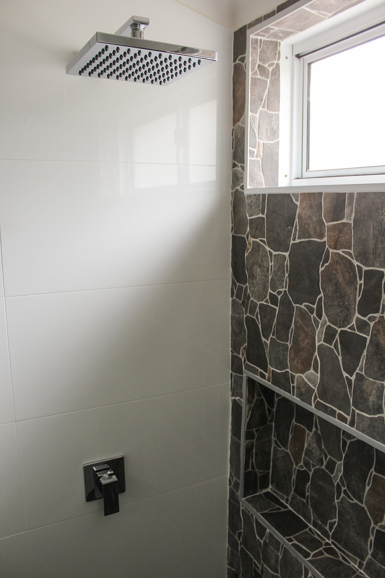 Sliding Shower Rail v Fixed Shower Head - On The Ball Bathrooms