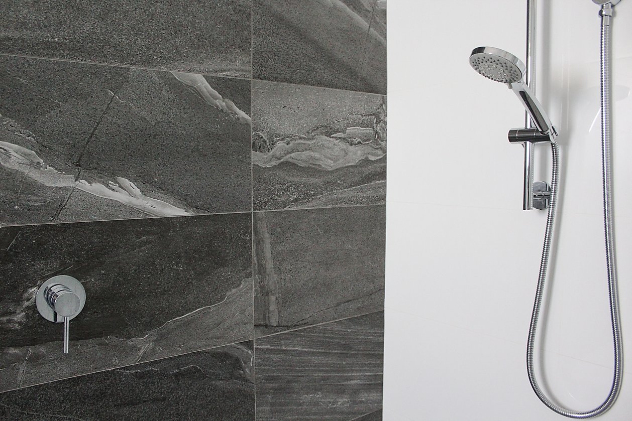 Sliding Shower Rail v Fixed Shower Head - On The Ball Bathrooms