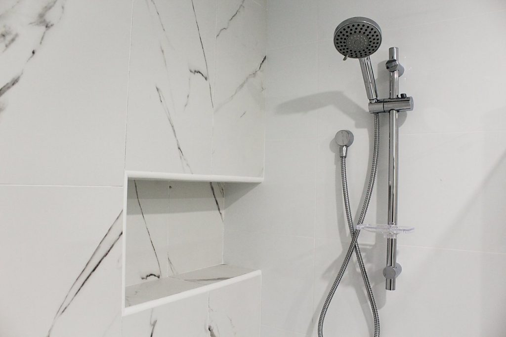 Sliding Shower Rail v Fixed Shower Head - On The Ball Bathrooms